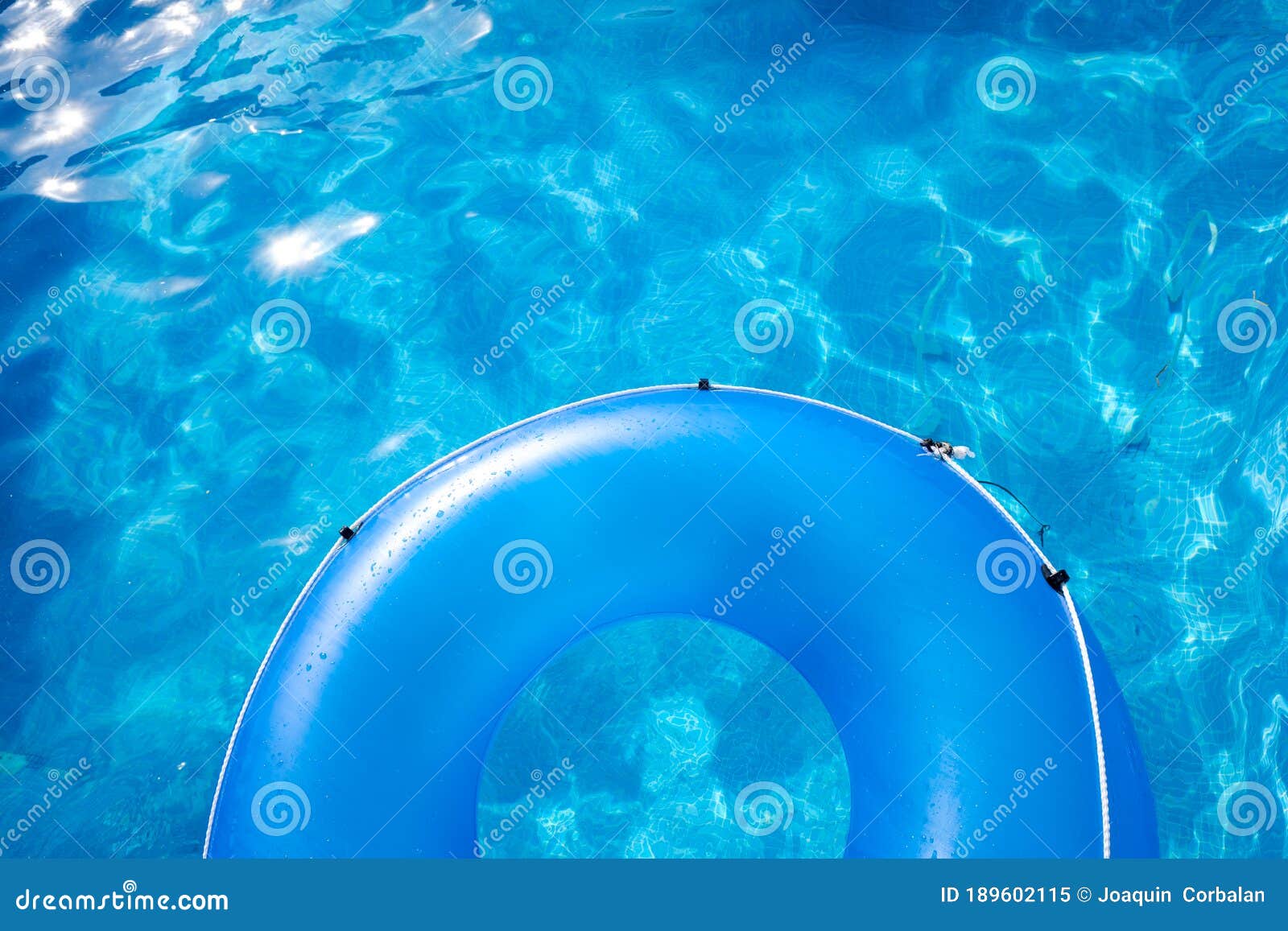 A Large Blue Round Float on a Pool of Transparent Water, Copy Space ...