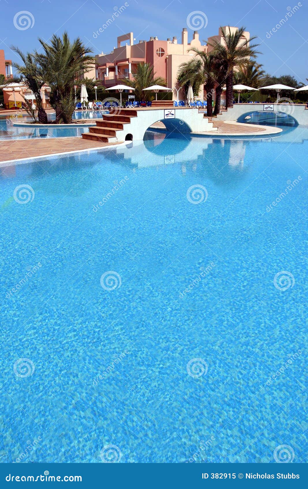 Large, Blue Swimming Pool in Luxurious Spanish Complex Stock Image ...