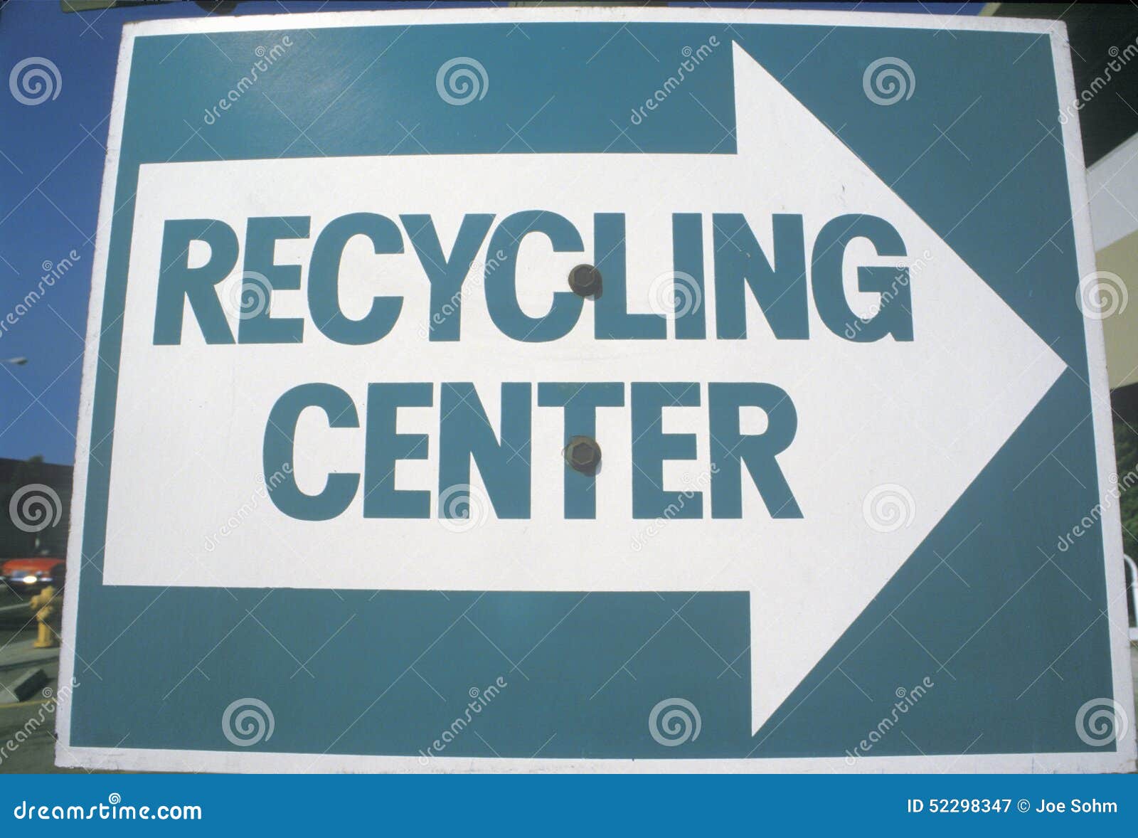 A Large Blue and White Sign Indicates a Right Turn for the Recycling ...