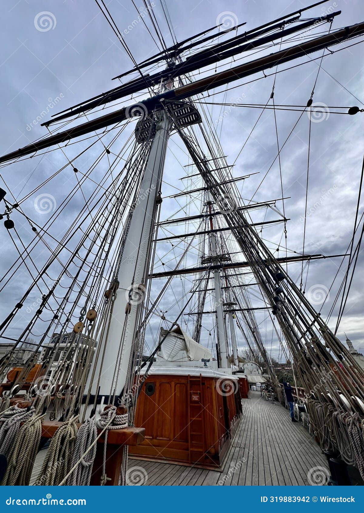 The Large Boat is Docked in the Harbor Surrounded by Ropes Stock Photo ...