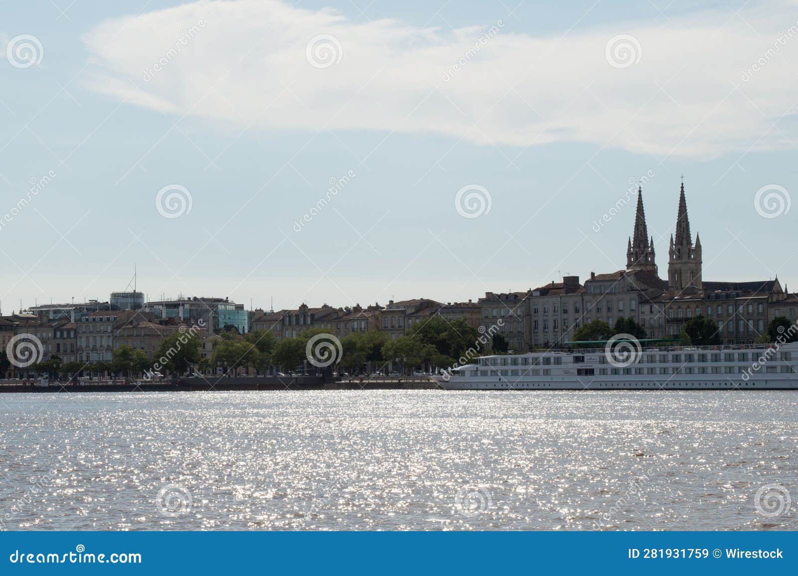 Large Boat on the River with Gothic Architecture in the Background on a ...