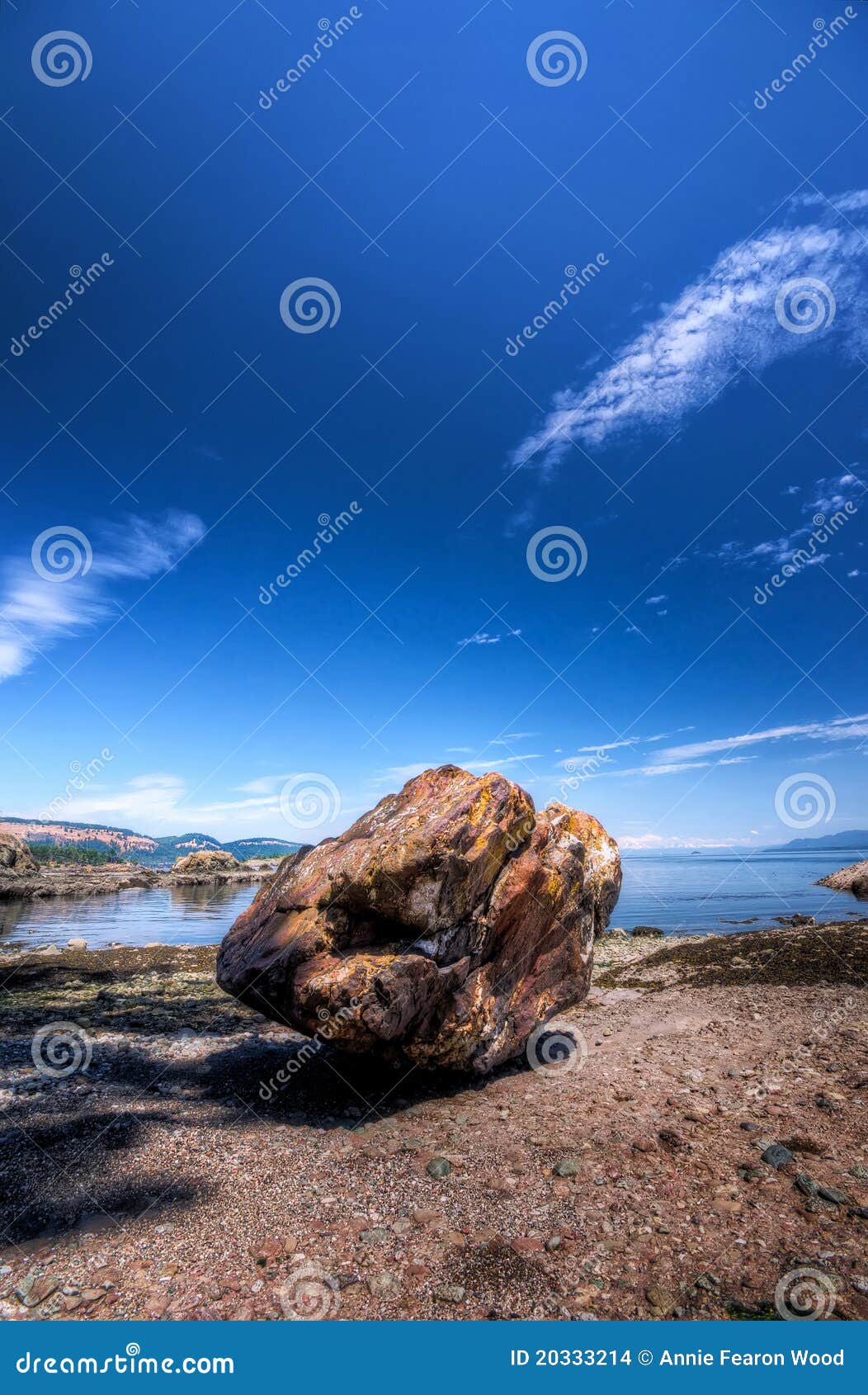 Large Boulder on Pacific Coast Stock Photo - Image of clouds, boulder ...