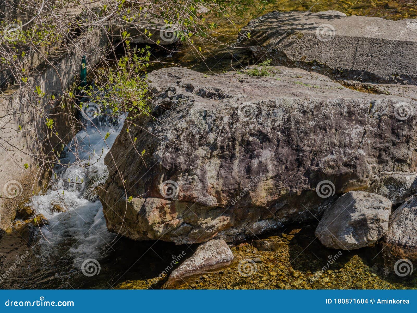 Large boulder in stream stock photo. Image of rocky - 180871604