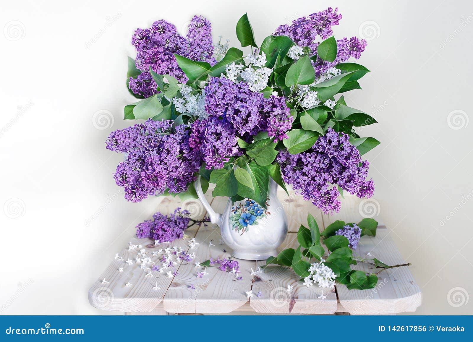 A Large Bouquet of Lilac in a White Vase on a White Background.Spring ...