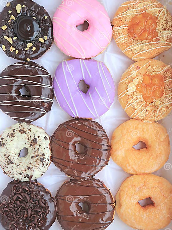 A Large Box of Colorful Assorted Delectable Doughnuts Stock Image ...