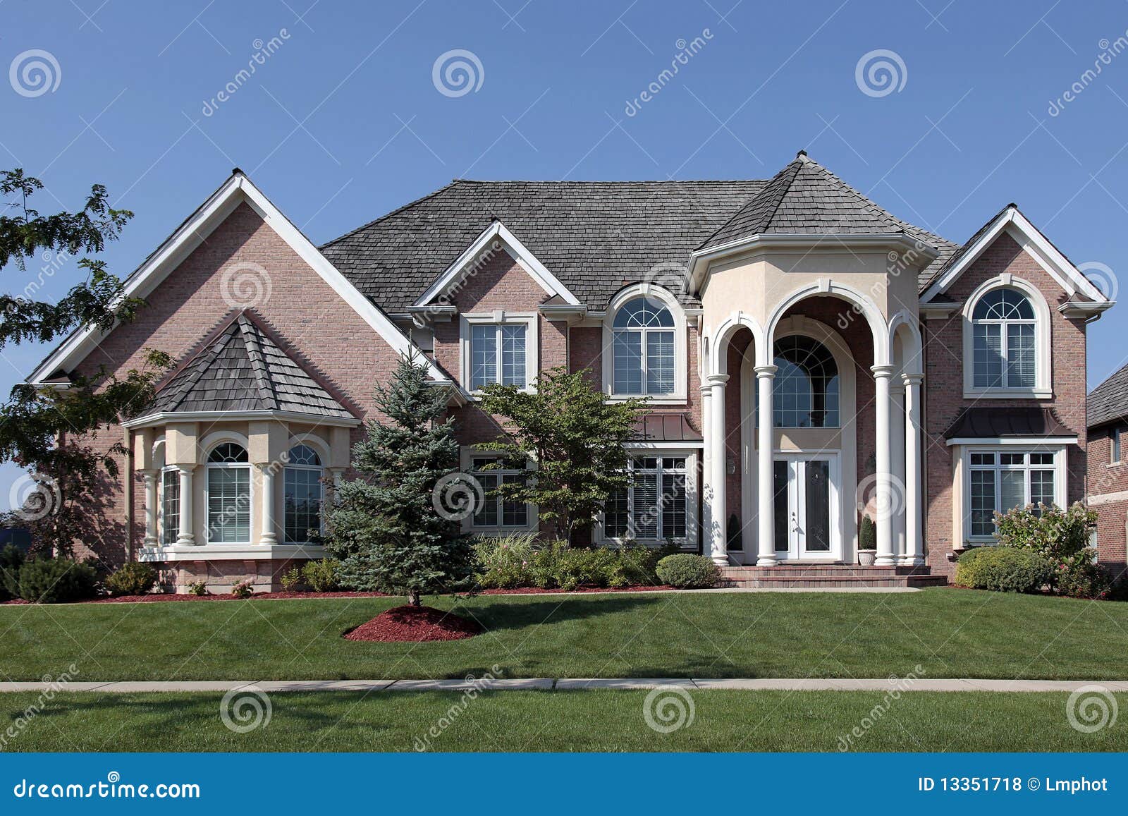 Large Brick Home with Columned Entryway Stock Photo - Image of ...