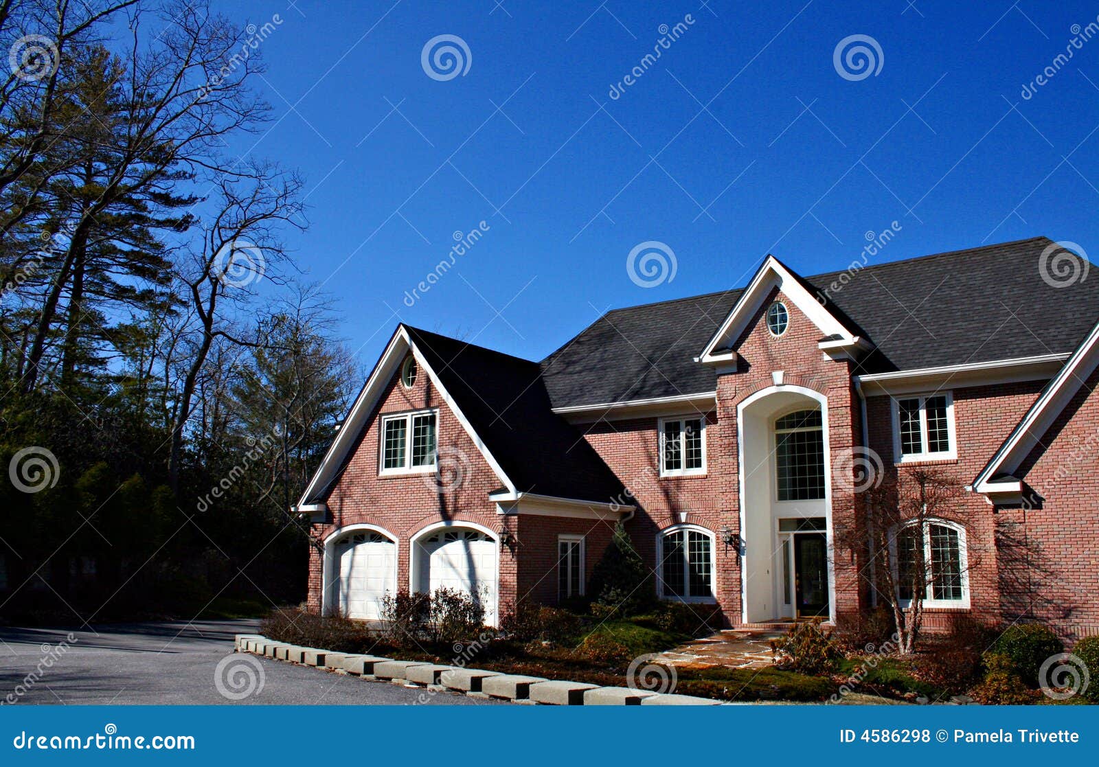 Large Brick Home with Double Garage Stock Photo - Image of large ...