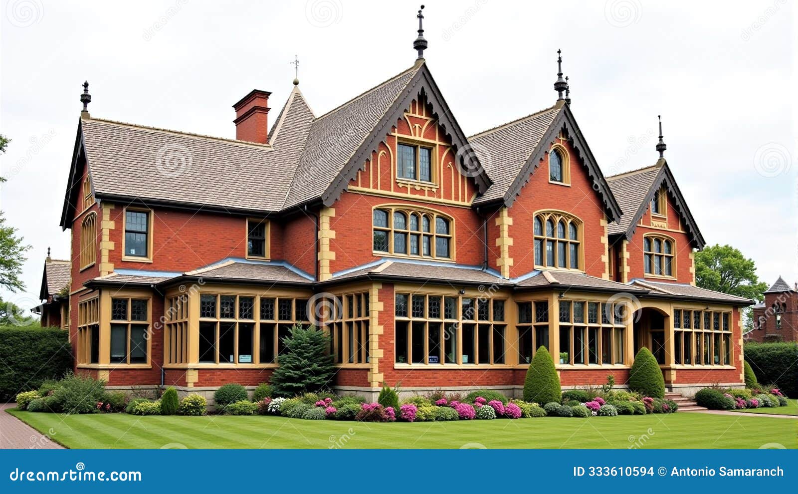 A Large Brick House with a Large Brick Chimney on the Roof Stock Photo ...