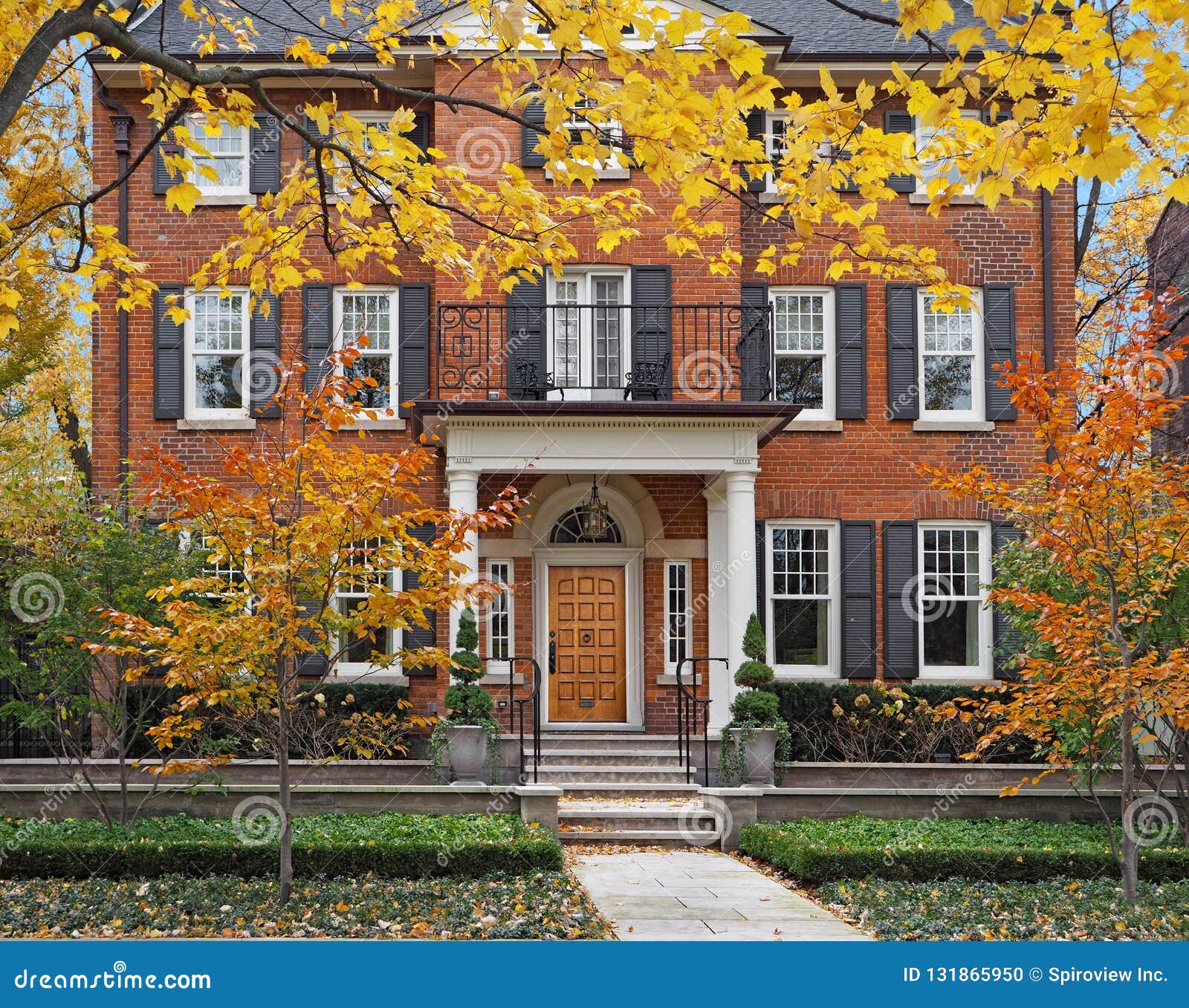 Large Brick House with Fall Colors Stock Photo - Image of maple ...