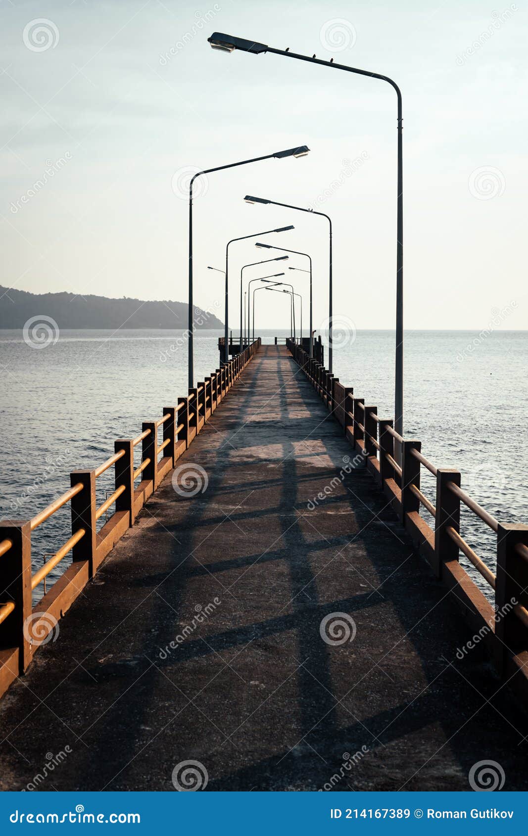 Bridge Perspective Passing through the Frame with Lampposts at Sunset ...