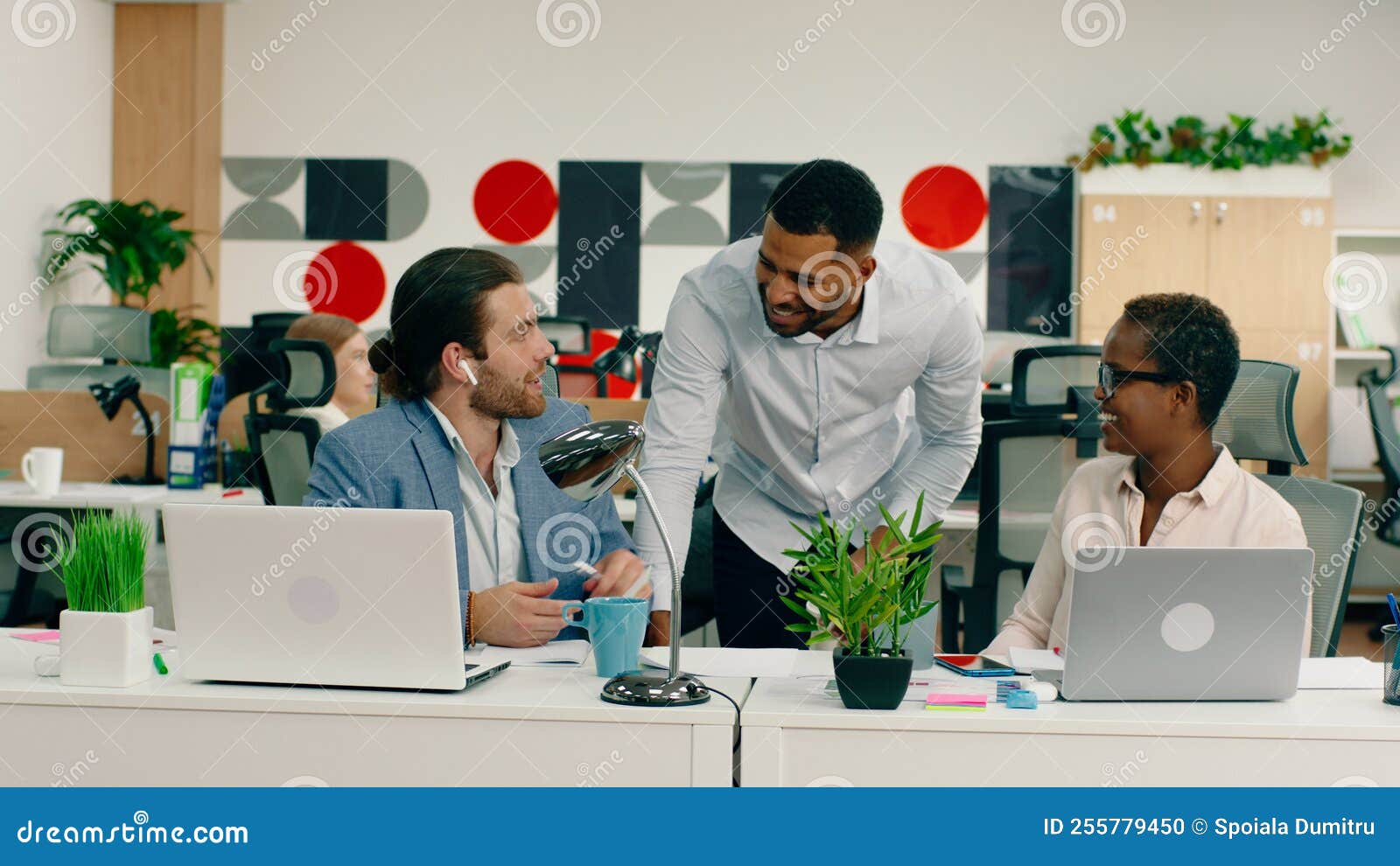 In a Large Bright Modern Office, a Group of Three Colleagues are Having ...