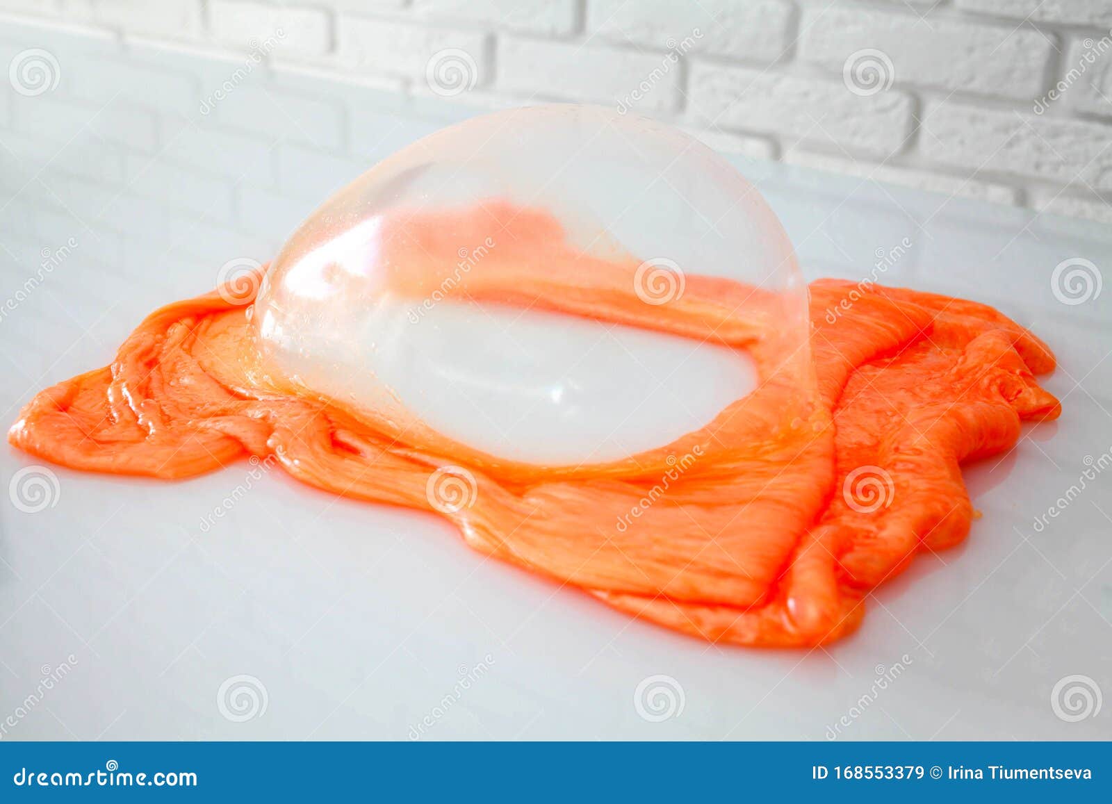 Large Bubble from an Slime on a White Table Stock Image - Image of ...