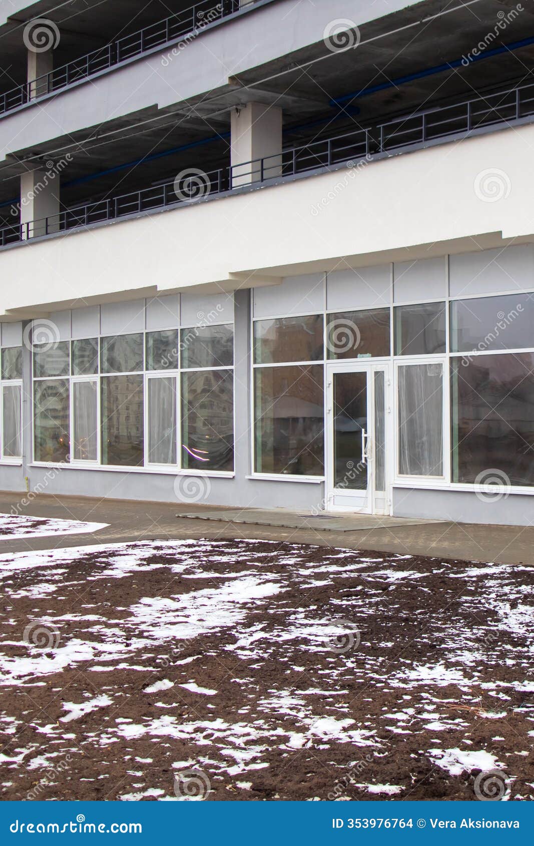 A Large Building that Features Numerous Windows and Multiple Doors ...