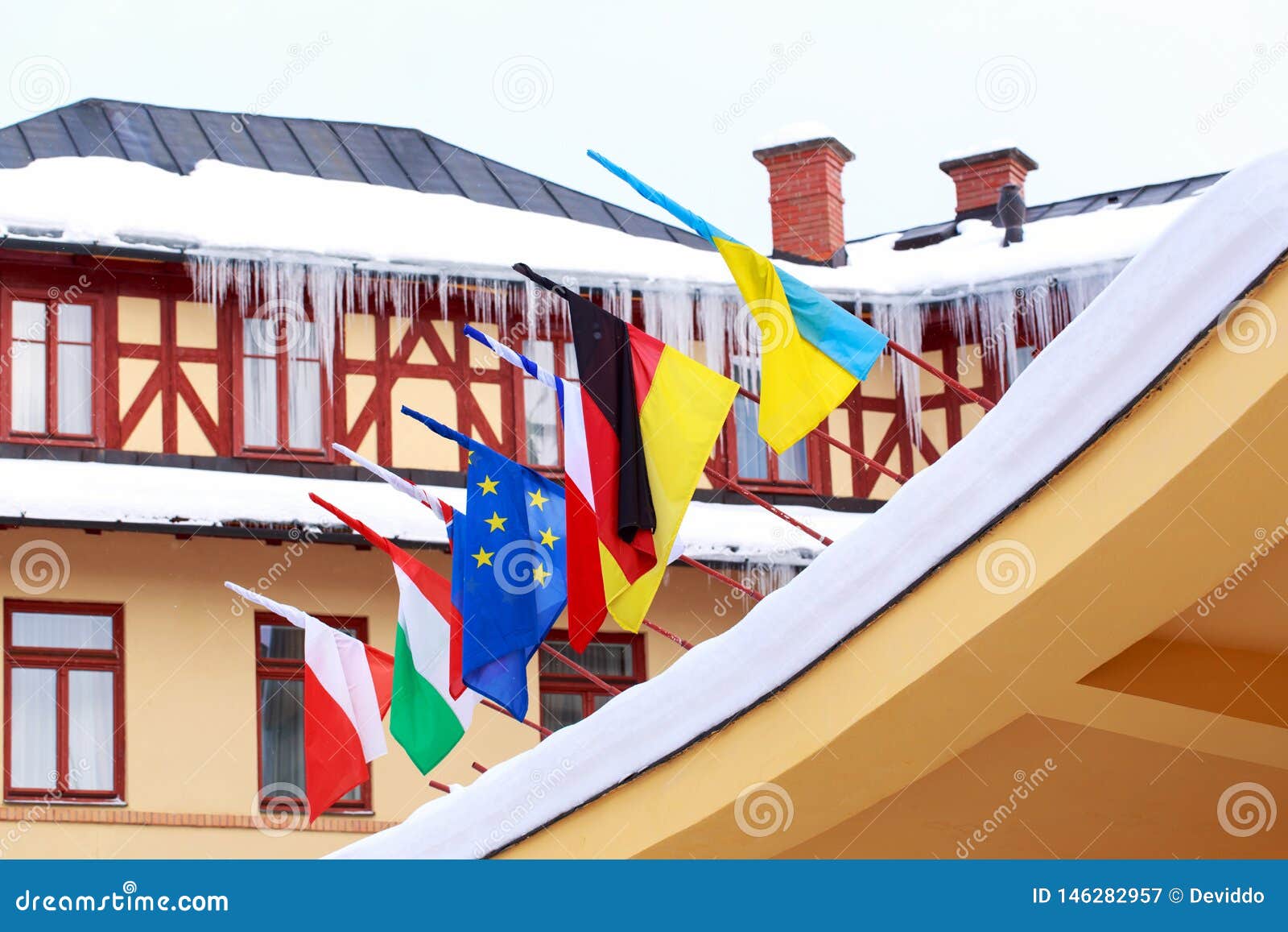 Large building with flags stock image. Image of window - 146282957