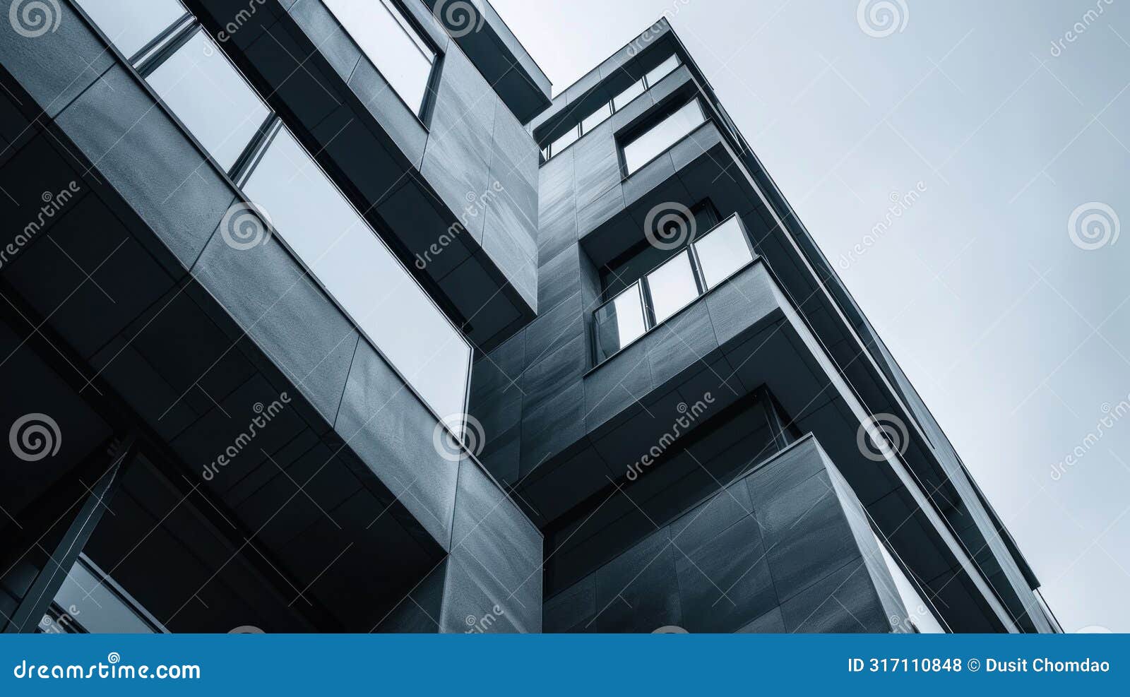 A Large Building with a Lot of Windows and a Slanted Roof Stock Photo ...