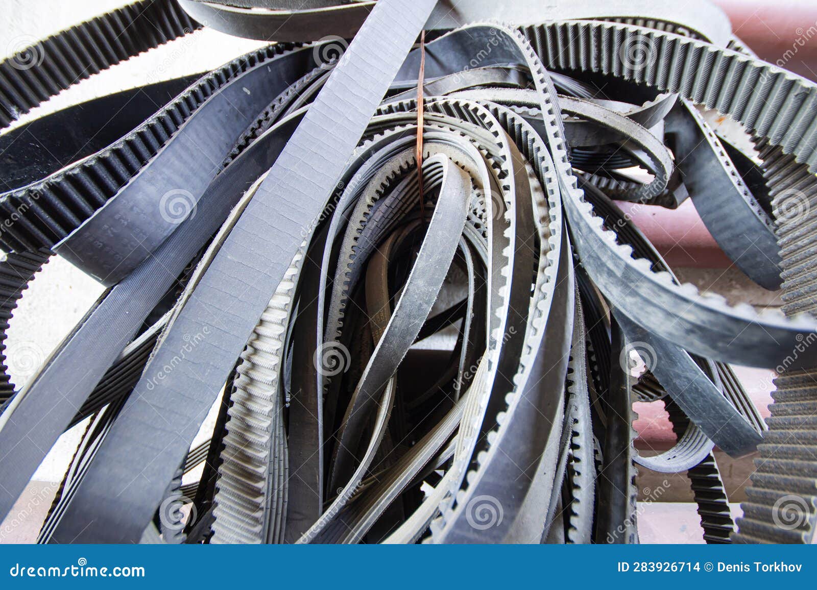 A Large Bunch of Used Timing Belts for a Spare in Case of a Broken ...