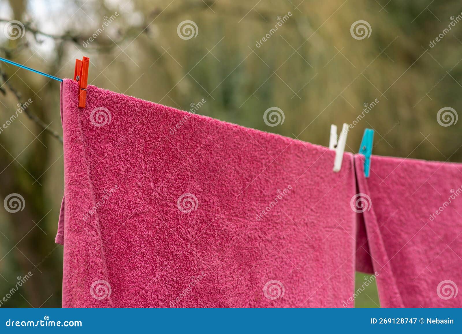 A Large Burgundy Towel Hangs on a Rope. Rope Drying Stock Image - Image ...
