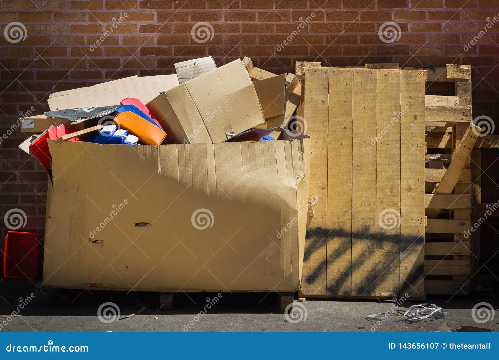 Large Cardboard Garbage Box and Timber Pallets Full of Rubbish Stock ...