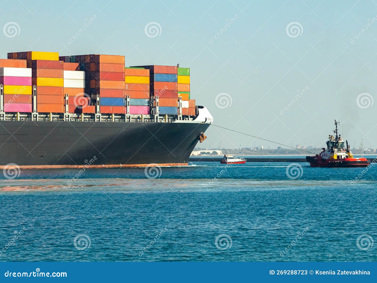 Large Cargo Container Ship Loaded with Containers Against the Blue Sky ...