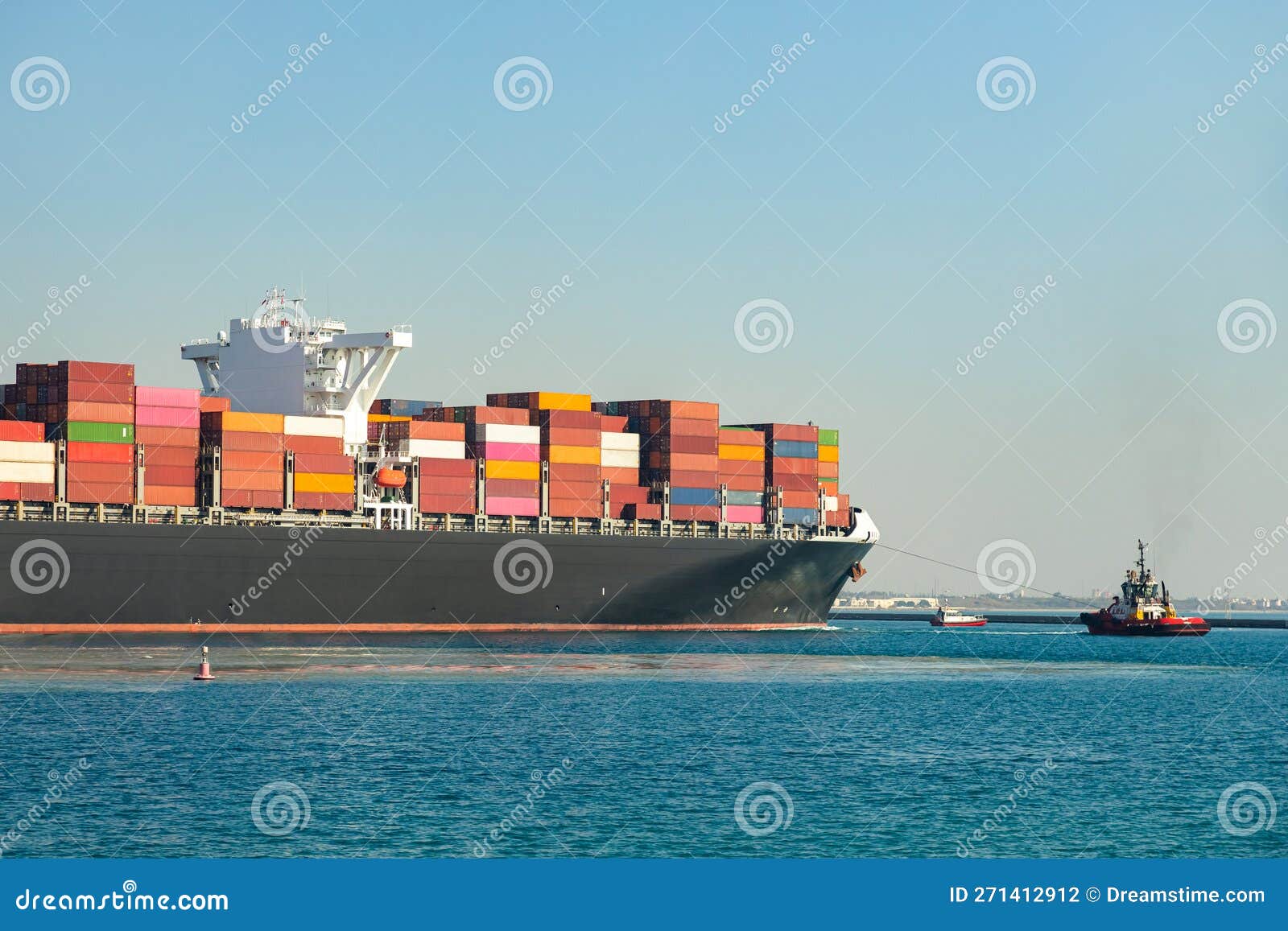 Large Cargo Container Ship Loaded with Containers Against the Blue Sky ...