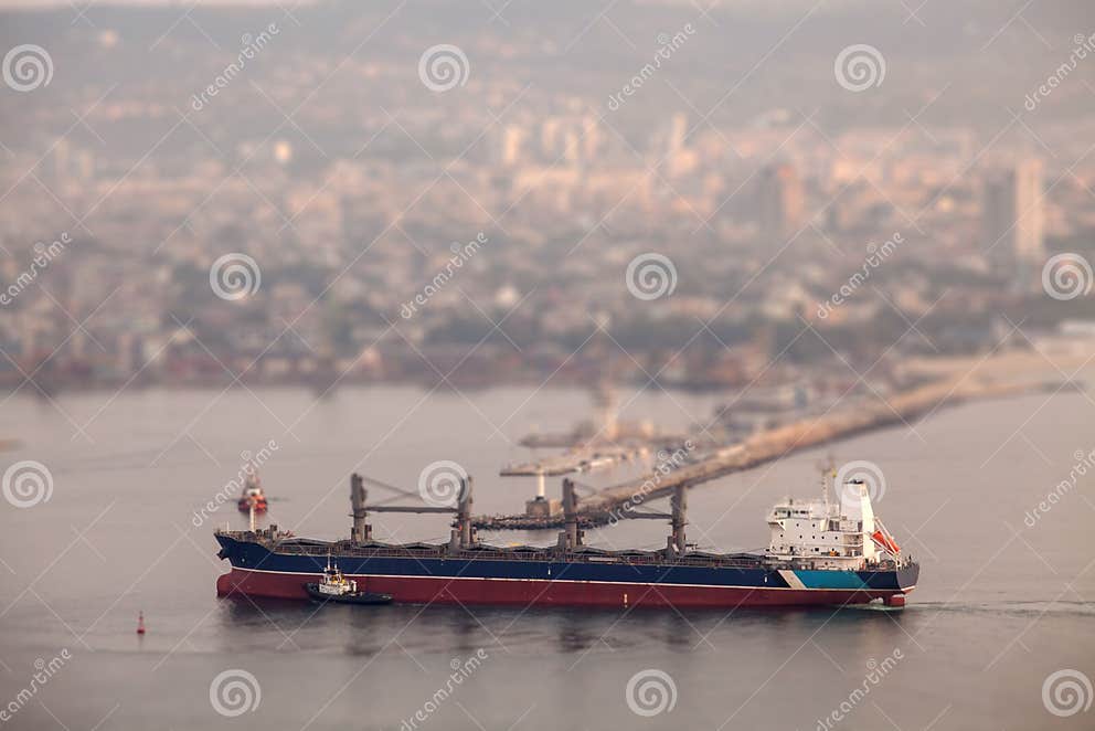 Large Cargo Ship Arriving in Port. Tilt-shift Effect Stock Image ...