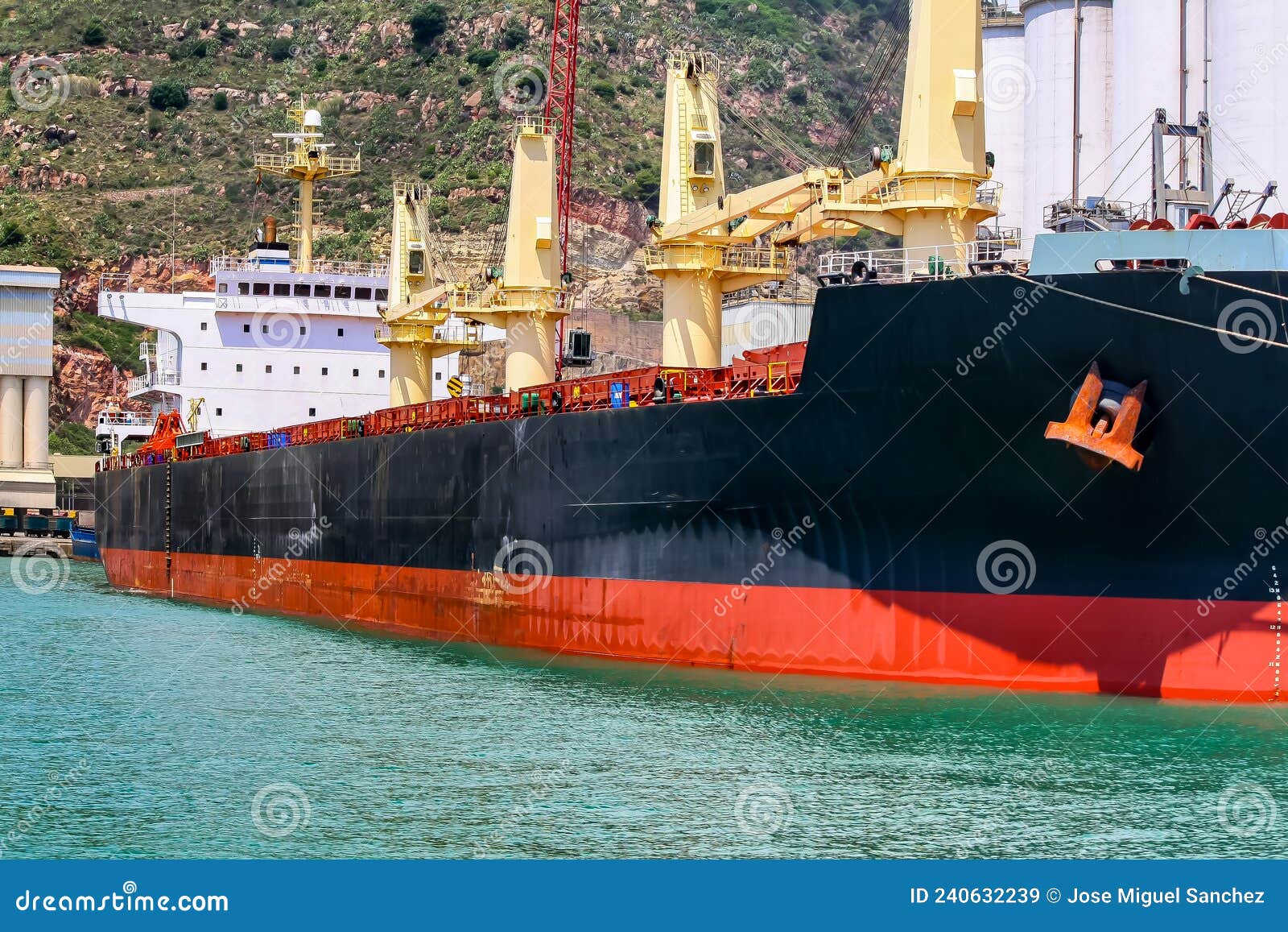 Large Cargo Ship in the Port of the City of Barcelona, Loading Goods ...