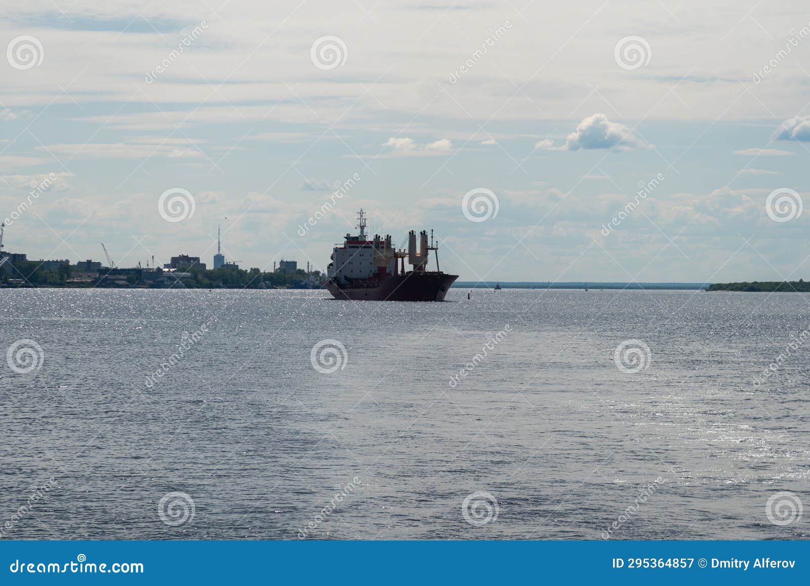 A Large Cargo Ship on the Roadstead on the River. Background Blue Sky ...