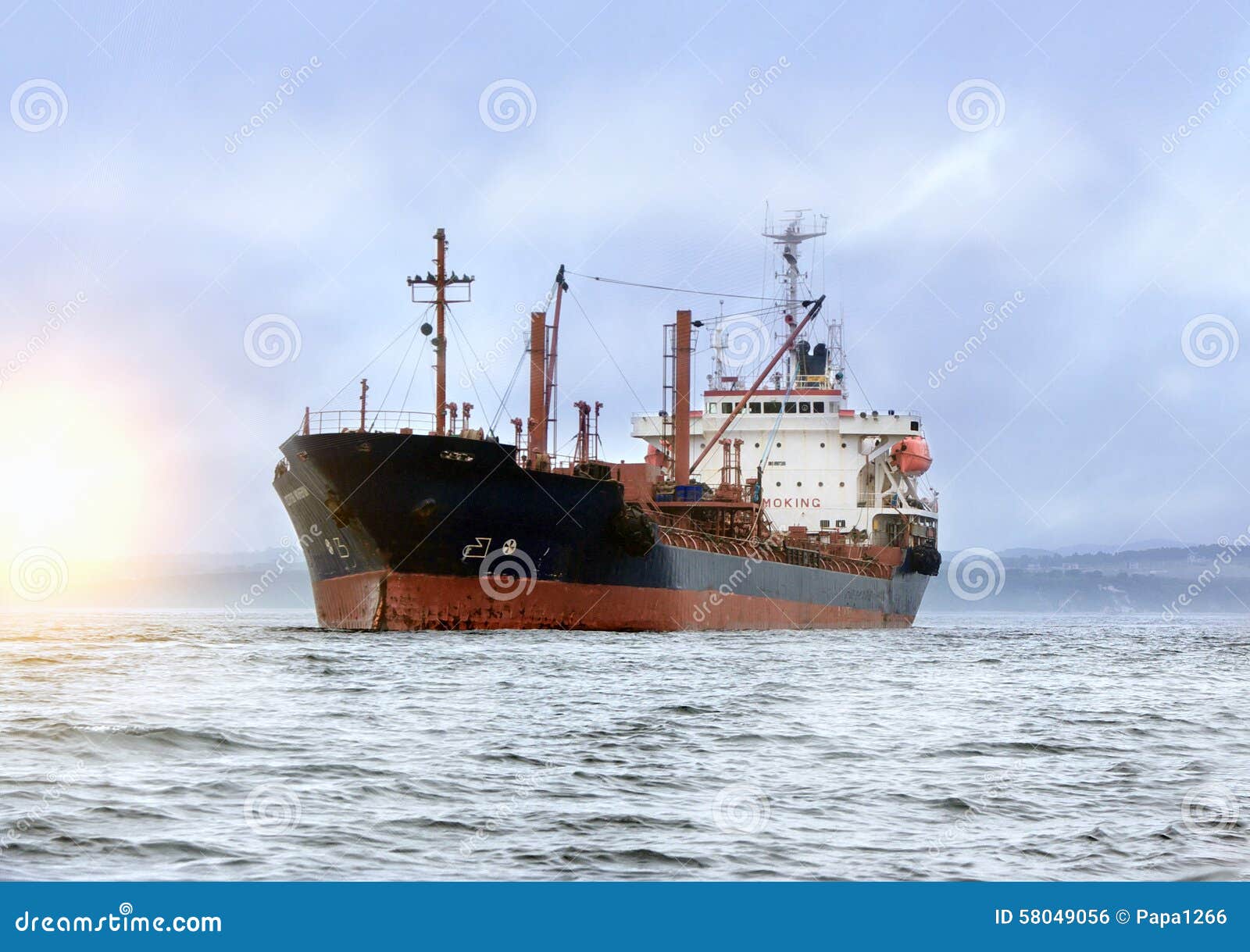 Large cargo ship at sea stock photo. Image of loading - 58049056