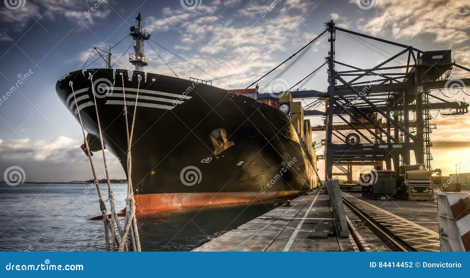 Large Cargo Ship Transferring Cargo Containers in Port Stock Photo ...