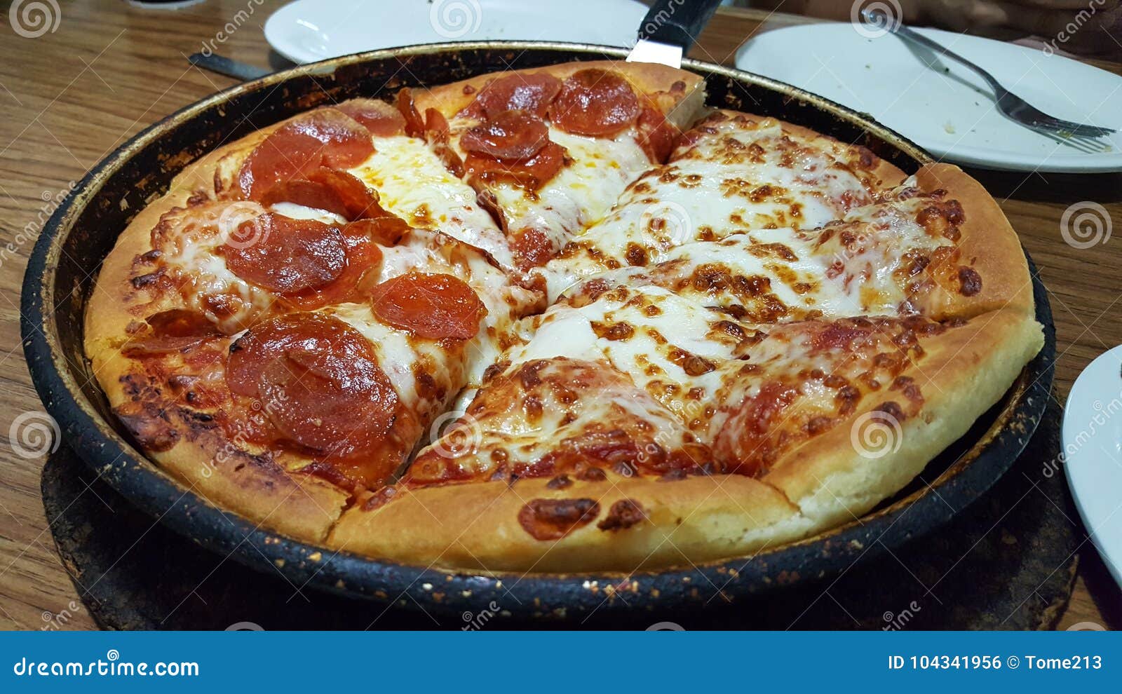 A large cheese pizza stock photo. Image of herbs, pizza - 104341956