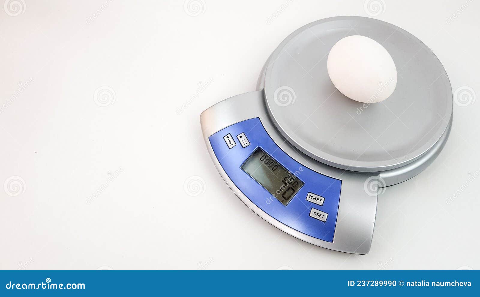 A Large Chicken Egg is Weighed on a Kitchen Scale. the Image is ...