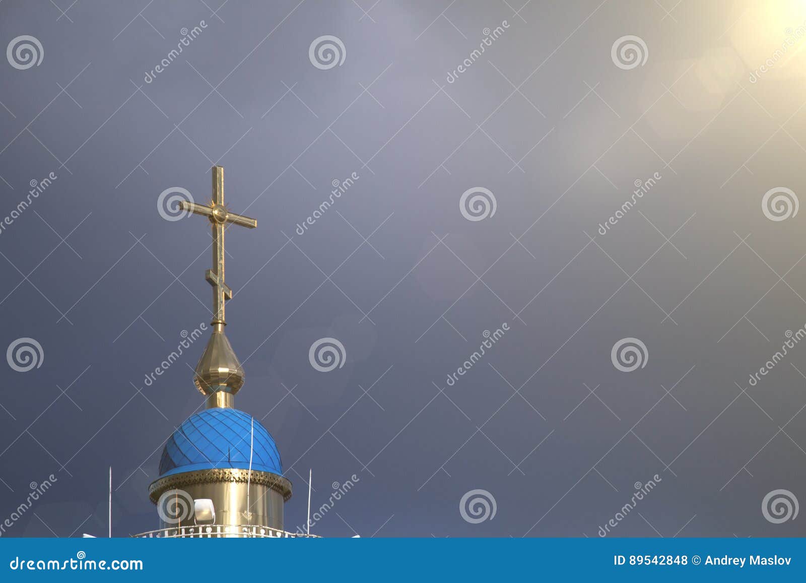 A Large Christian Cross on Which Falls a Ray of Sun through the Clouds ...