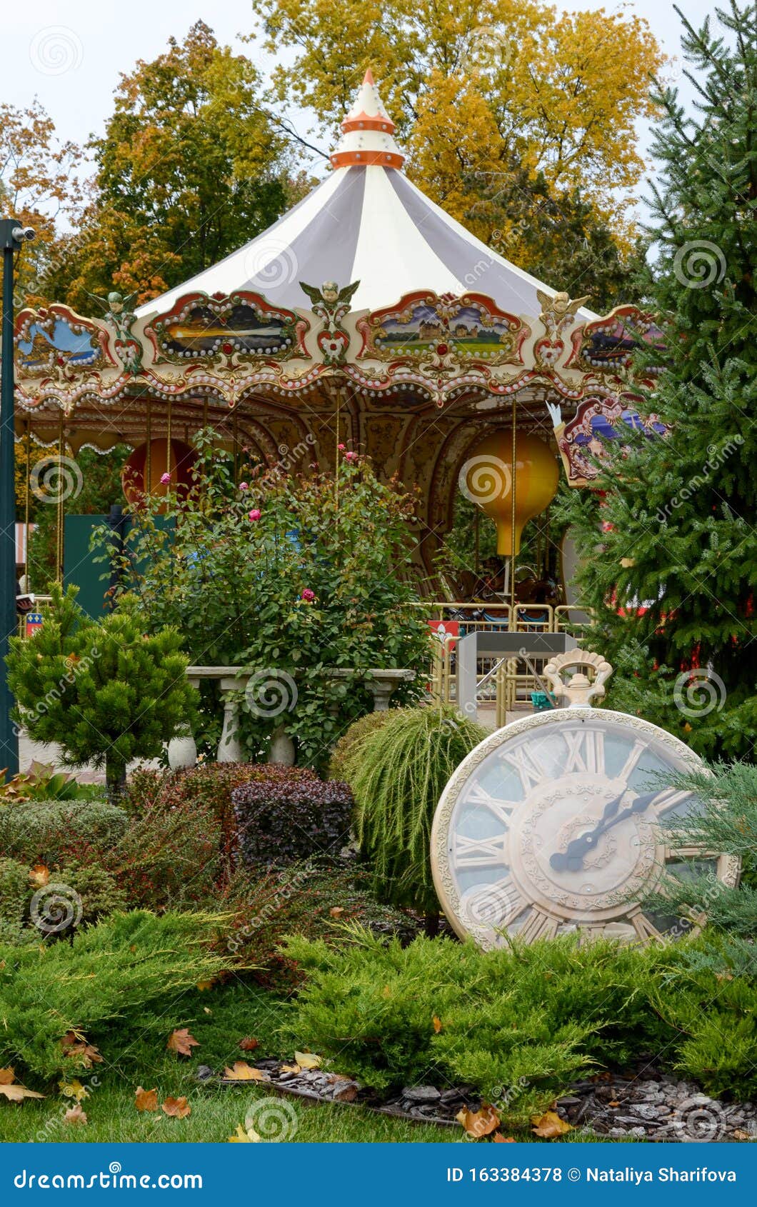 Large Clock on the Background of a Carousel Stock Photo - Image of ...