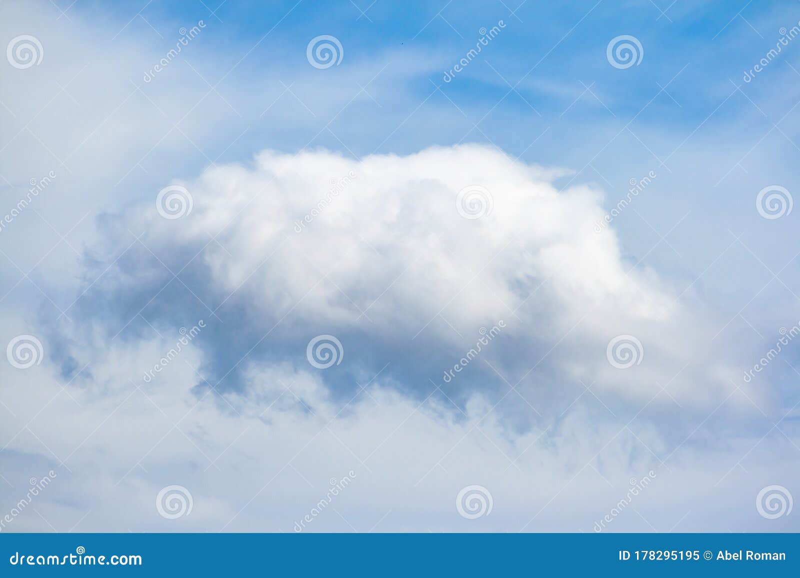 A Large Cloud, Cumulus, Surrounded by Diffuse Clouds with a Blue Sky in ...