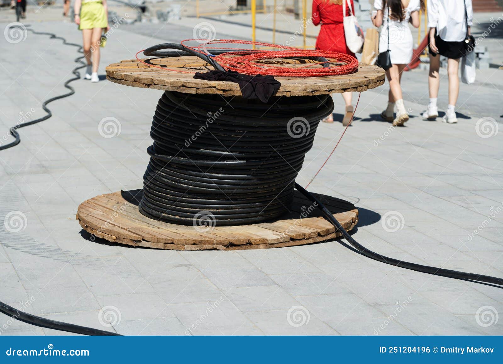 A Large Coil of Electrical Wire is Lying on the Footpath. Construction ...