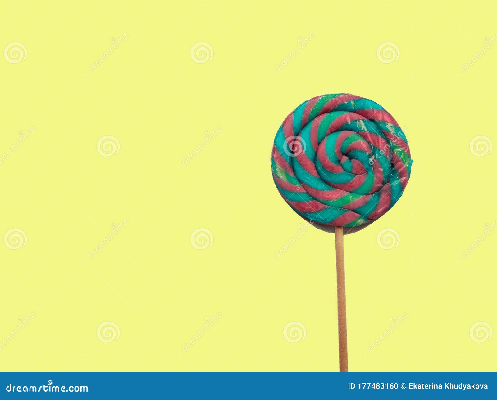 A Large Colored Lollipop Isolated on a Yellow Background Stock Photo ...