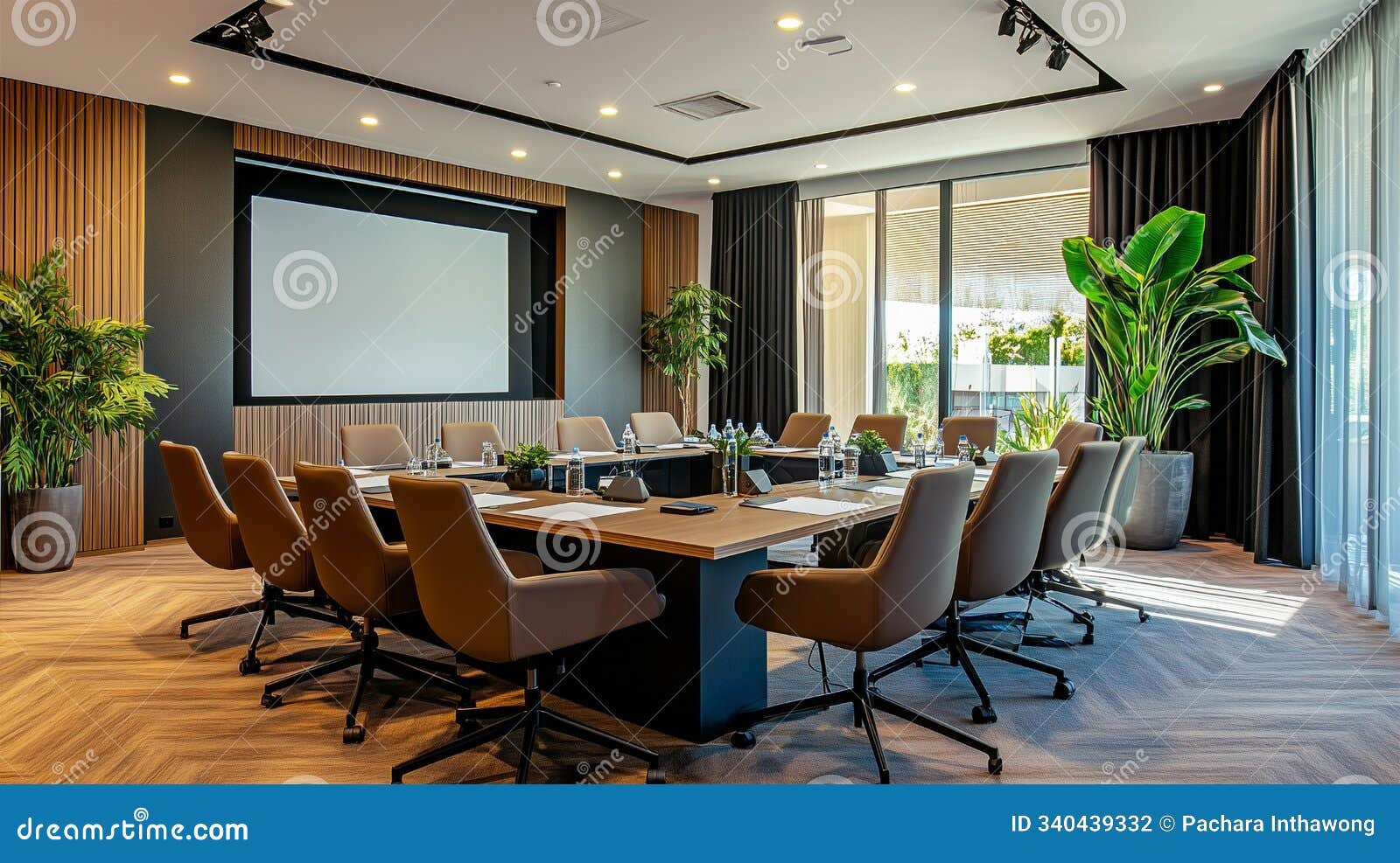 A Large Conference Room with a Projector Screen and a Large Table Stock ...