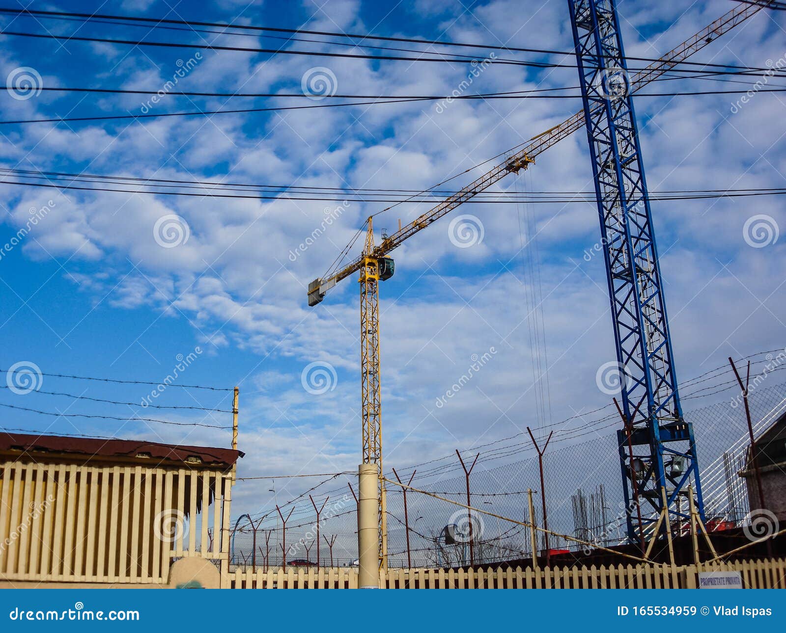 Large Construction Site Including Several Cranes Working on a Building ...