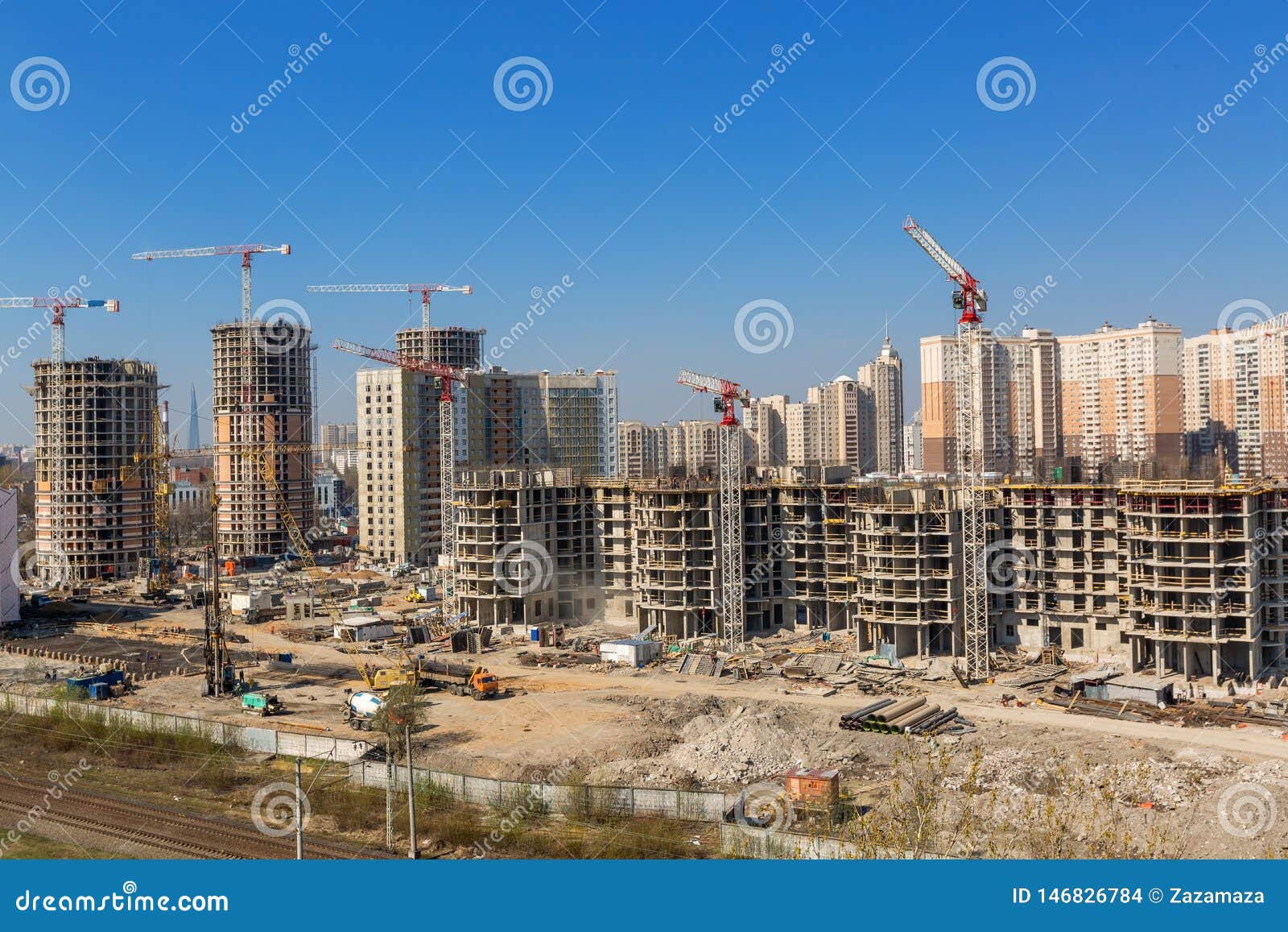 Large Construction Site Including Several Cranes Working on a Building ...