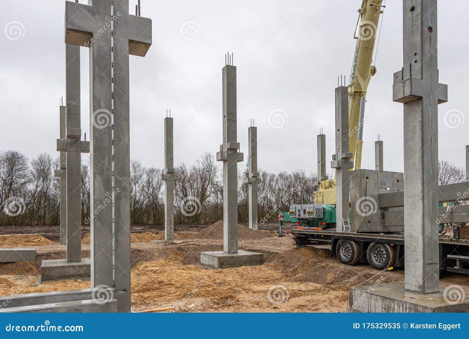 A Large Construction Site Many Concrete Columns are Placed with the ...