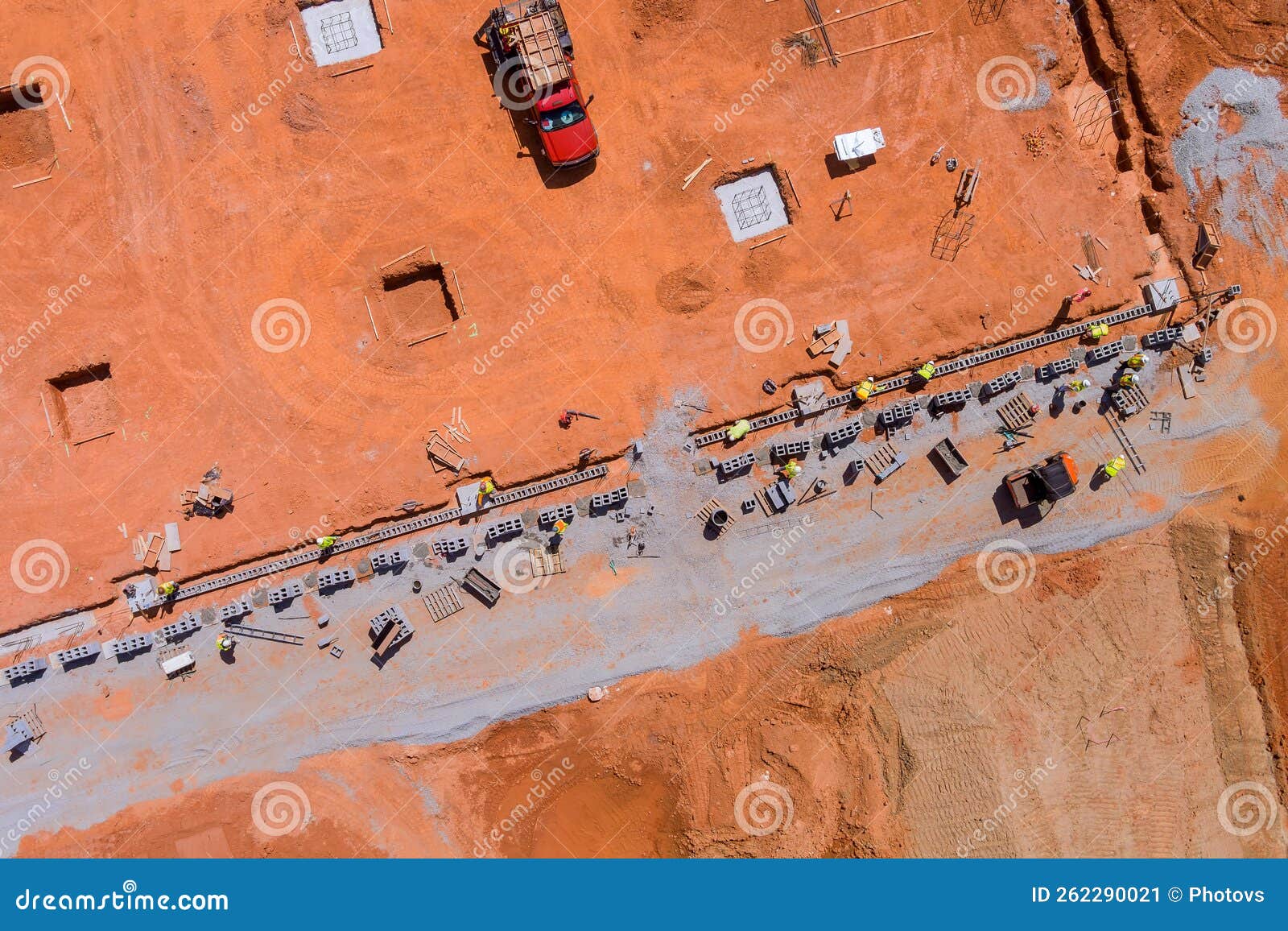 In a Large Construction Site, Trenches are Being Prepared for the ... In a Large Construction Site, Trenches are Being Prepared for the ...