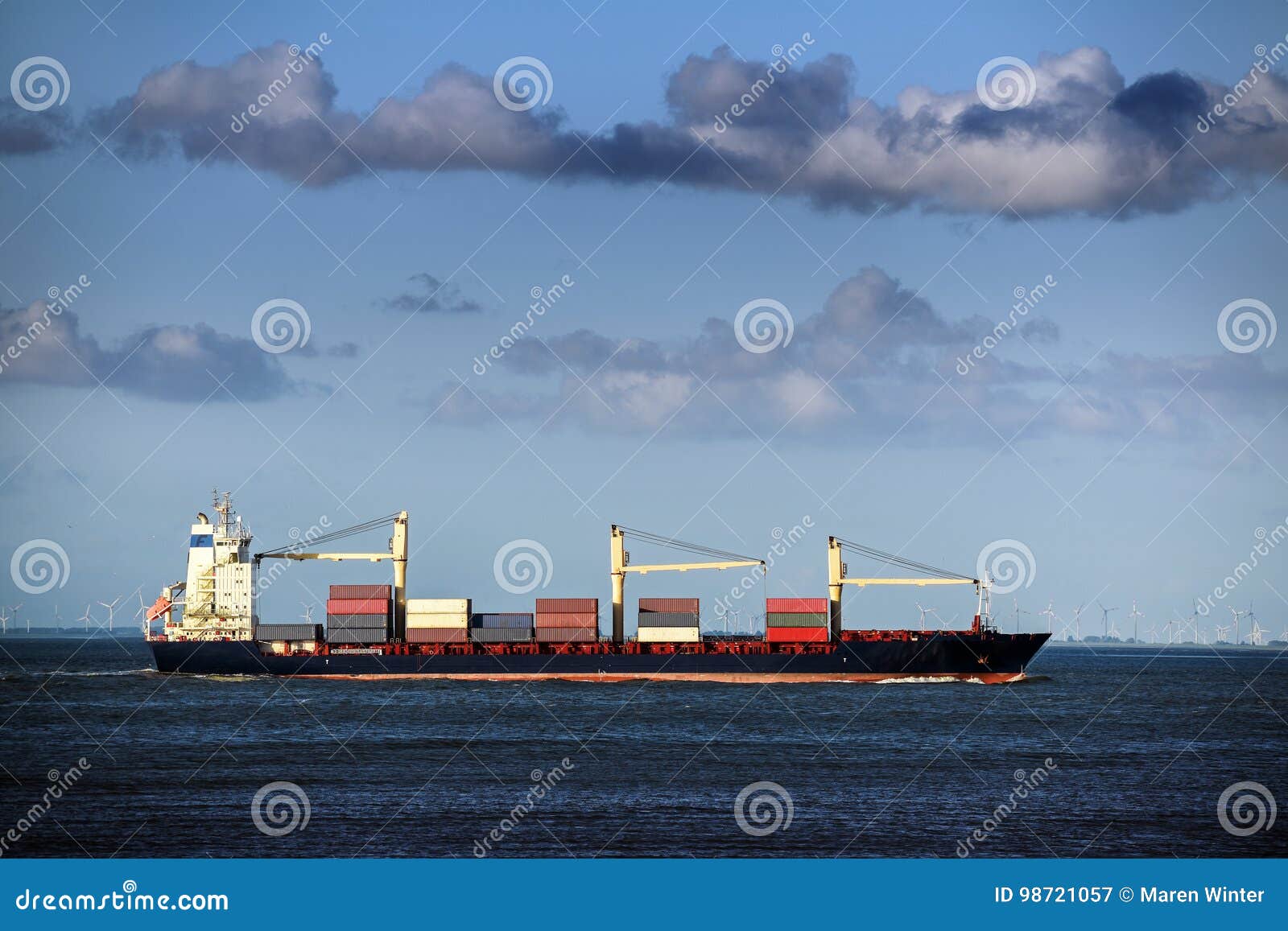 Large Container Ship in the North Sea Under a Cloudy Blue Sky, C Stock ...