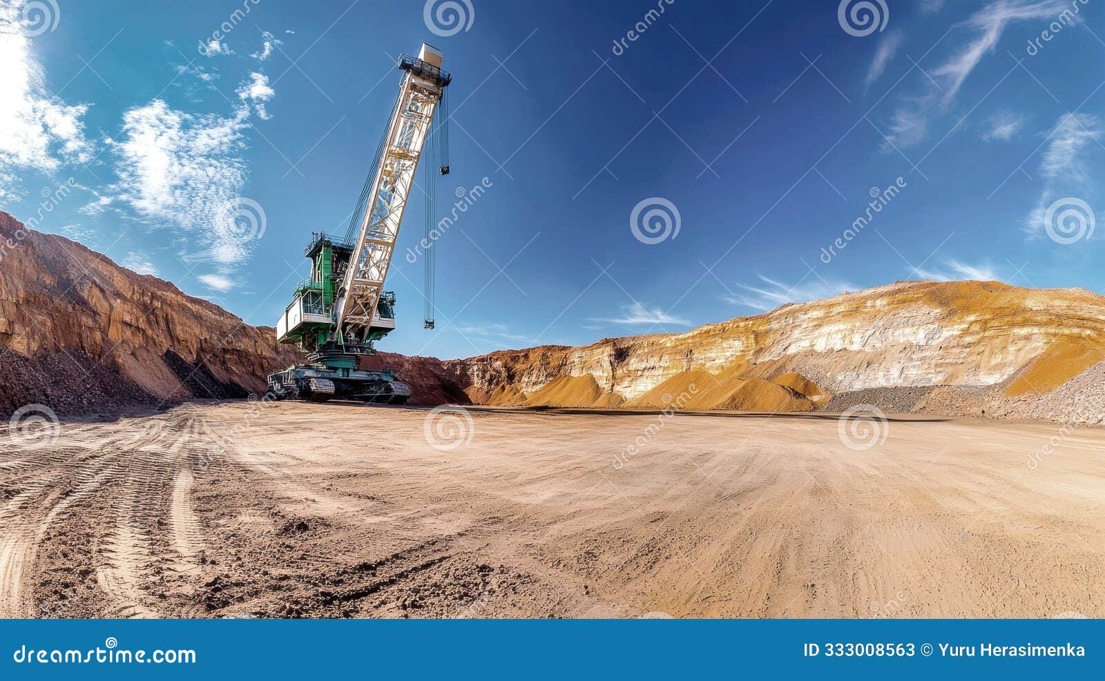 A Large Crane Stands Over a Coal Pit Surrounded by Sandy Terrain ...