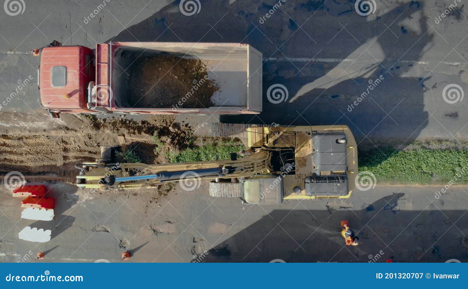 Large Crawler Excavator Digging Ground and Load it into Dump Truck on ...