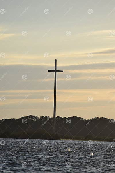 Large Cross by the River stock photo. Image of dusk, ocean - 98745214
