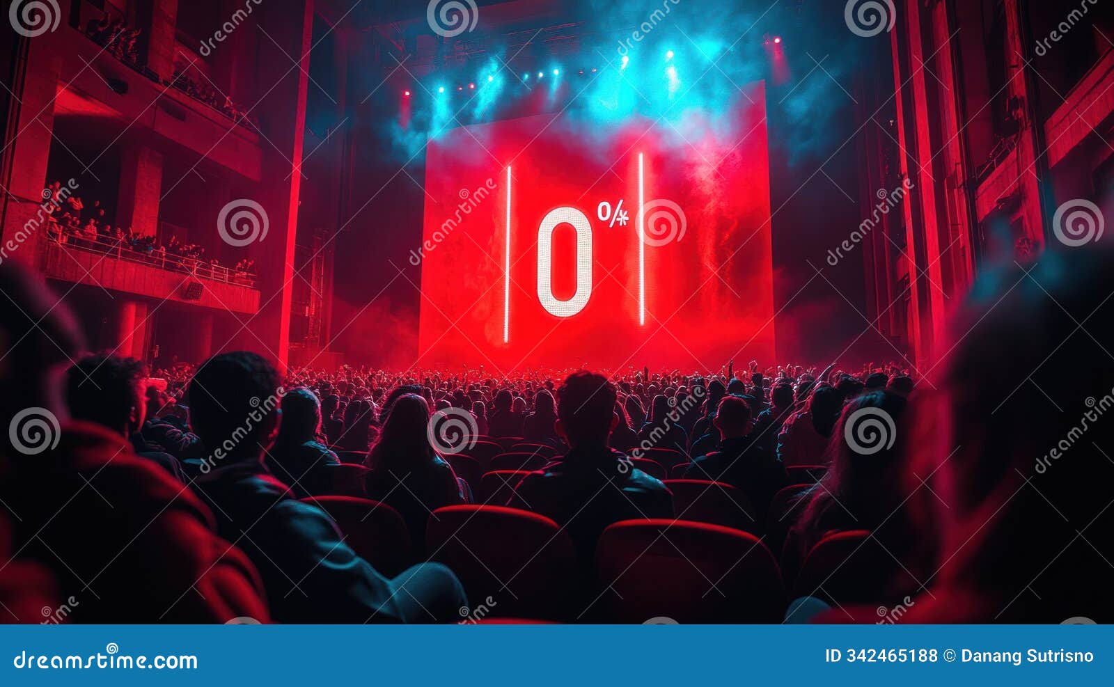 A Large Crowd of People Attending a Concert in a Darkened Concert Hall ...