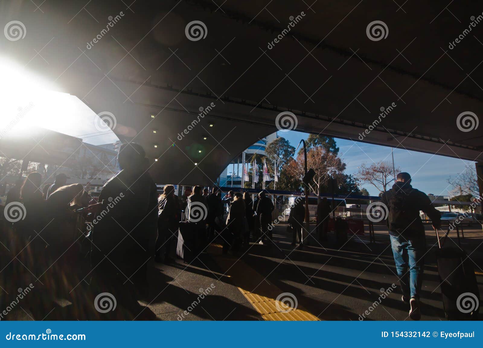 Large Crowds of Tourists People Standing and Waiting Under a Highway ...