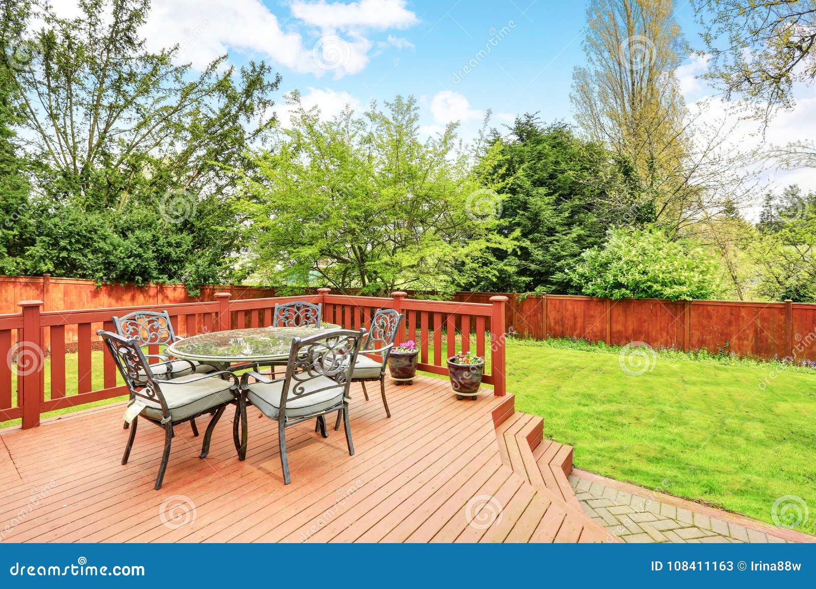 Large Deck with Dining Space Overlooking Spacious Back Yard. Stock ...