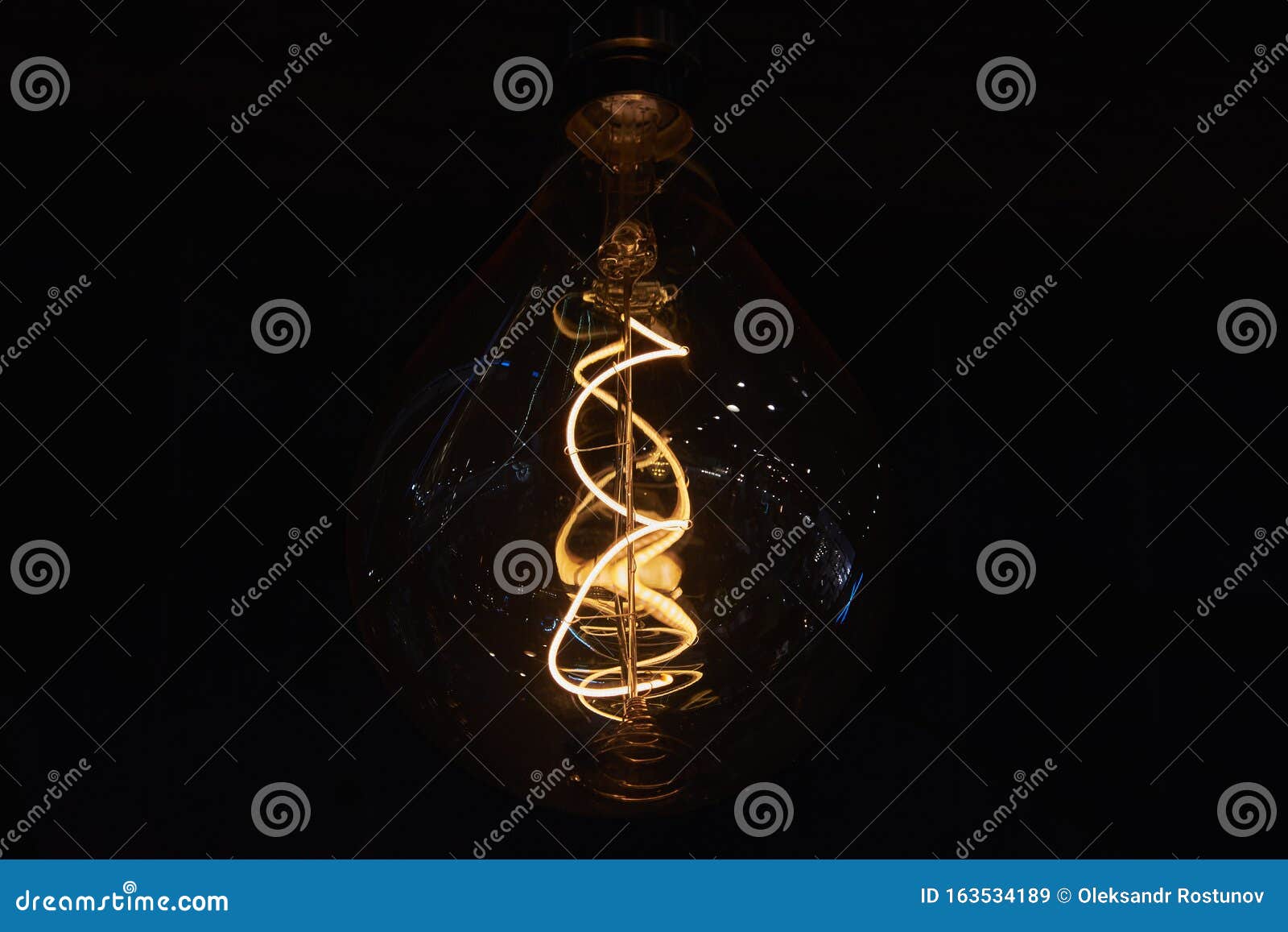 Large Decorative Incandescent Lamp on a Dark Background. Numerous Light ...
