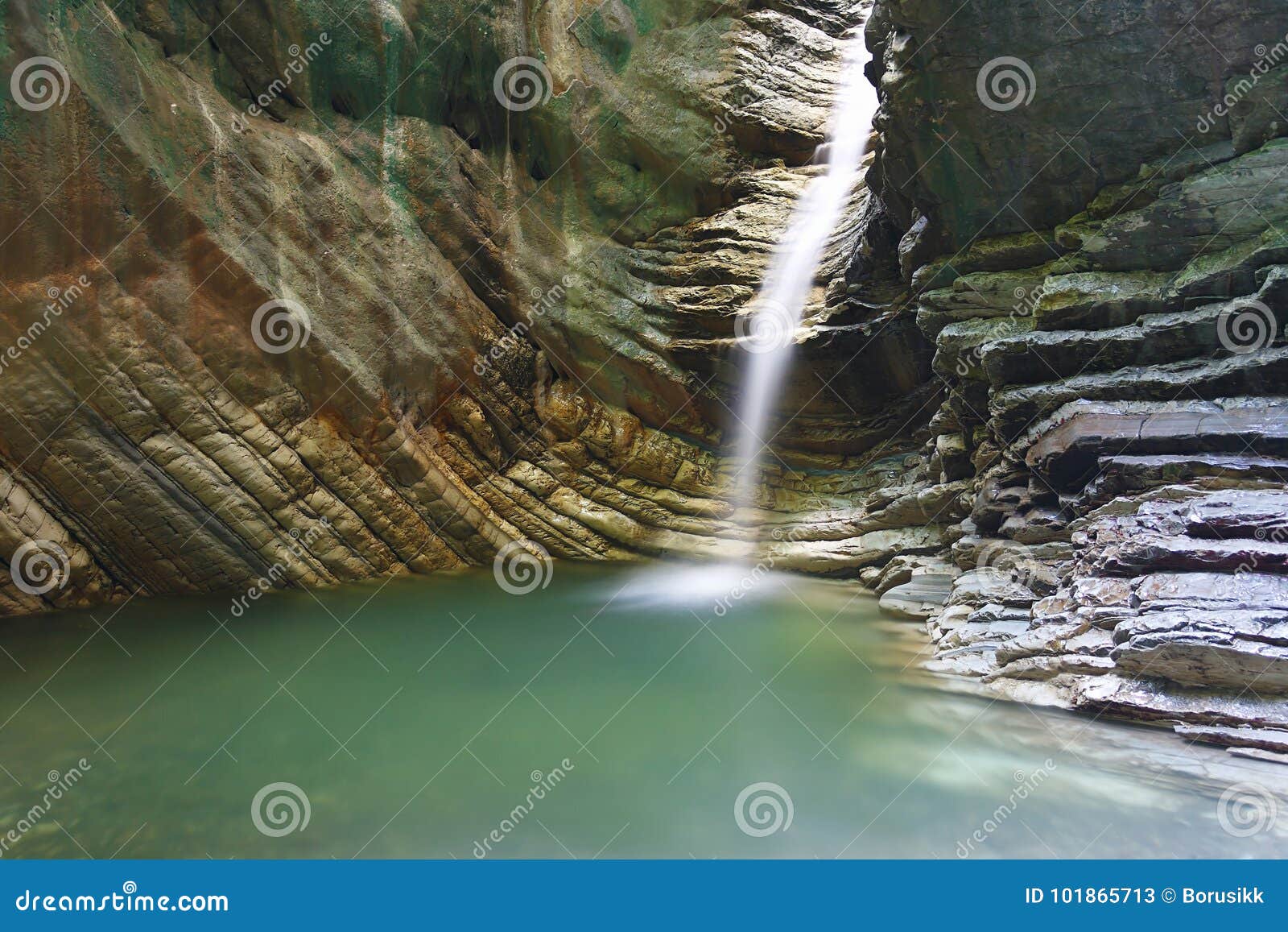 Large Deep Grotto with Flowing Beautiful Waterfall Stock Image - Image ...